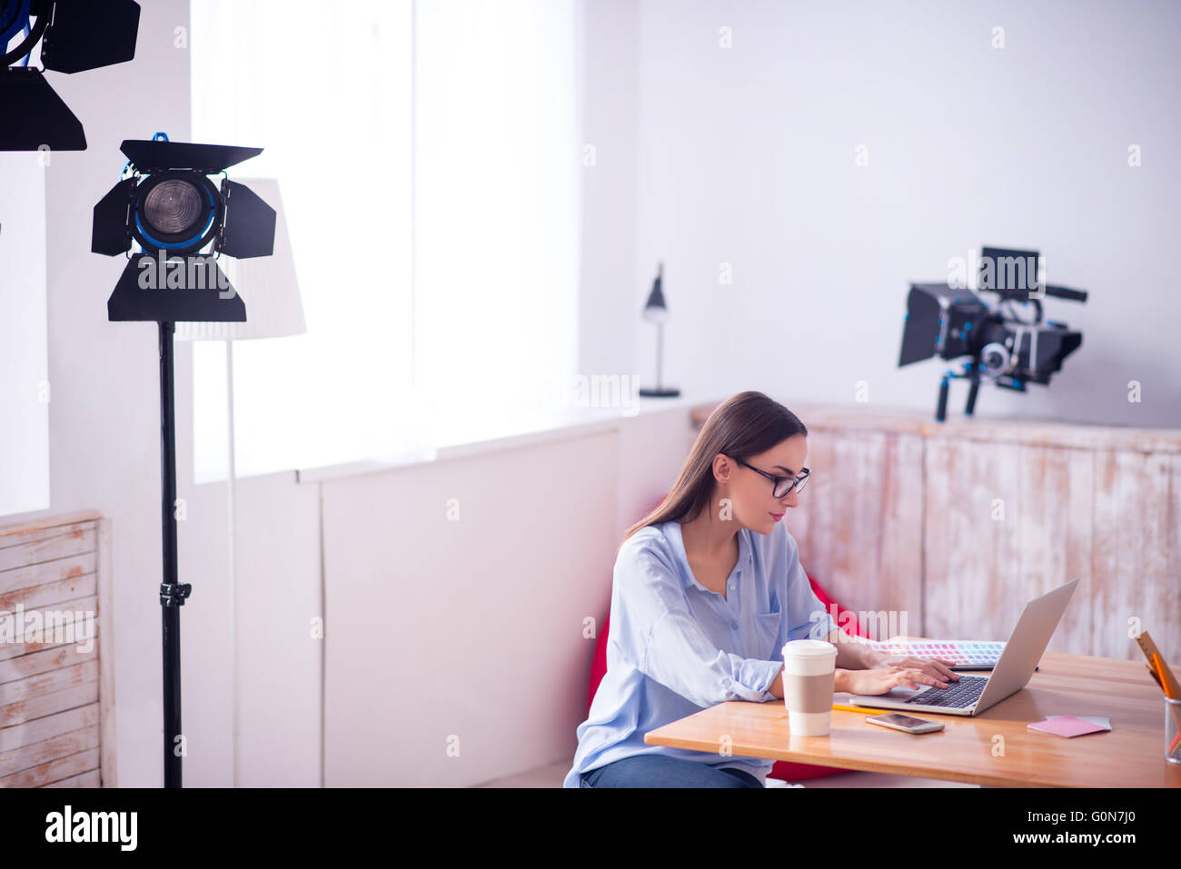 Concentrated woman sit table hi-res stock photography and images - Alamy