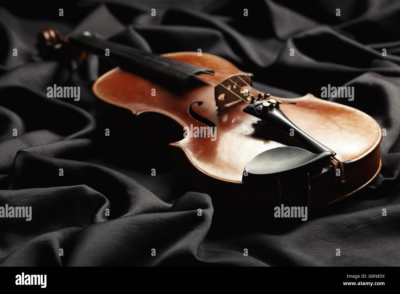 aged violin on dark texture Stock Photo - Alamy