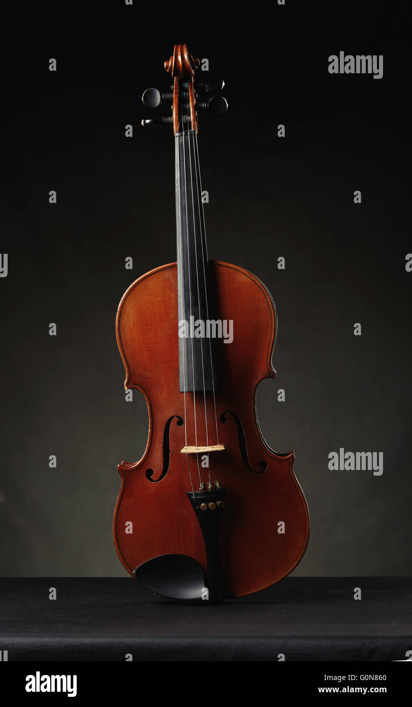 aged violin on dark background Stock Photo - Alamy