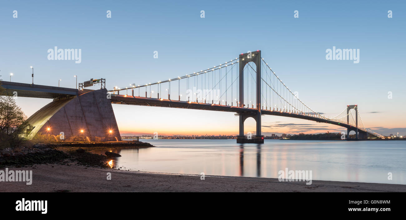 The Bronx-Whitestone Bridge reflecting on the East River at night in ...