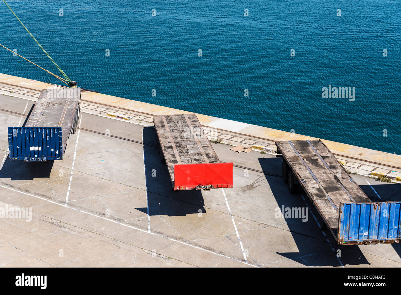 Empty containers parked in a row waiting to board at the port of ...
