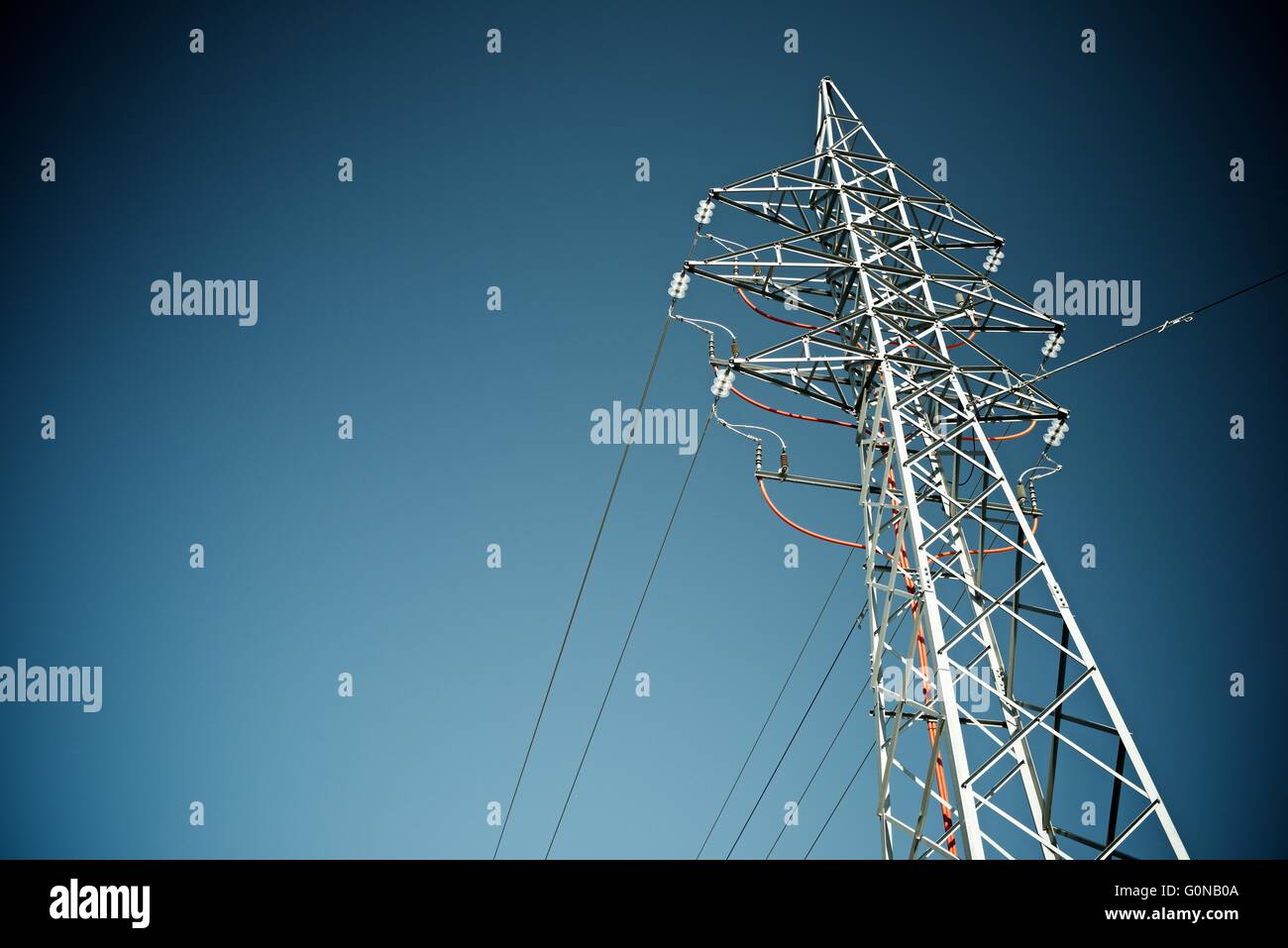 Power line with clear blue sky Stock Photo - Alamy