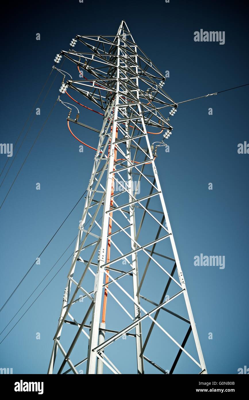 Power line with clear blue sky Stock Photo - Alamy