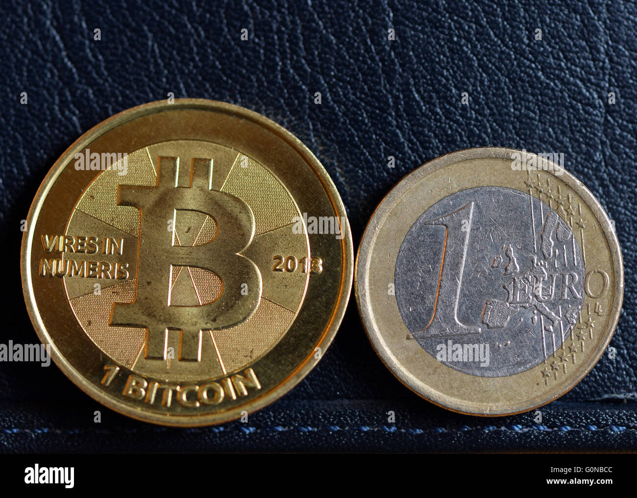 ILLUSTRATION A Bitcoin And A Euro Coin Are Photographed During The