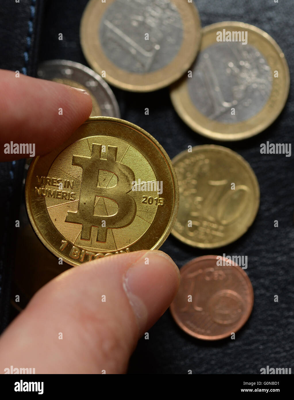 ILLUSTRATION A Bitcoin And Euro Coins Are Photographed During The