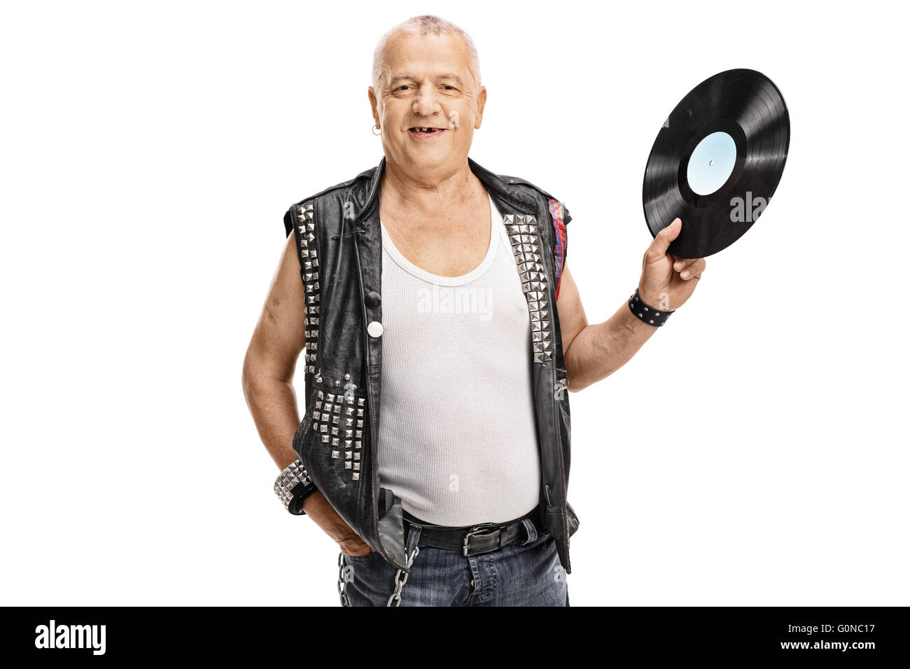 Mature punk rocker holding a vinyl record and looking at the camera ...