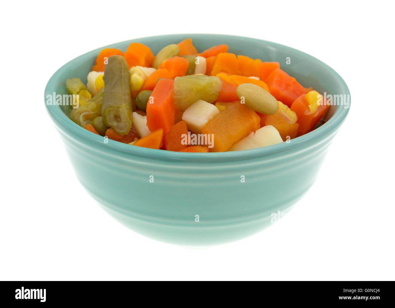 Side view of a portion of mixed vegetables in a small bowl isolated on ...