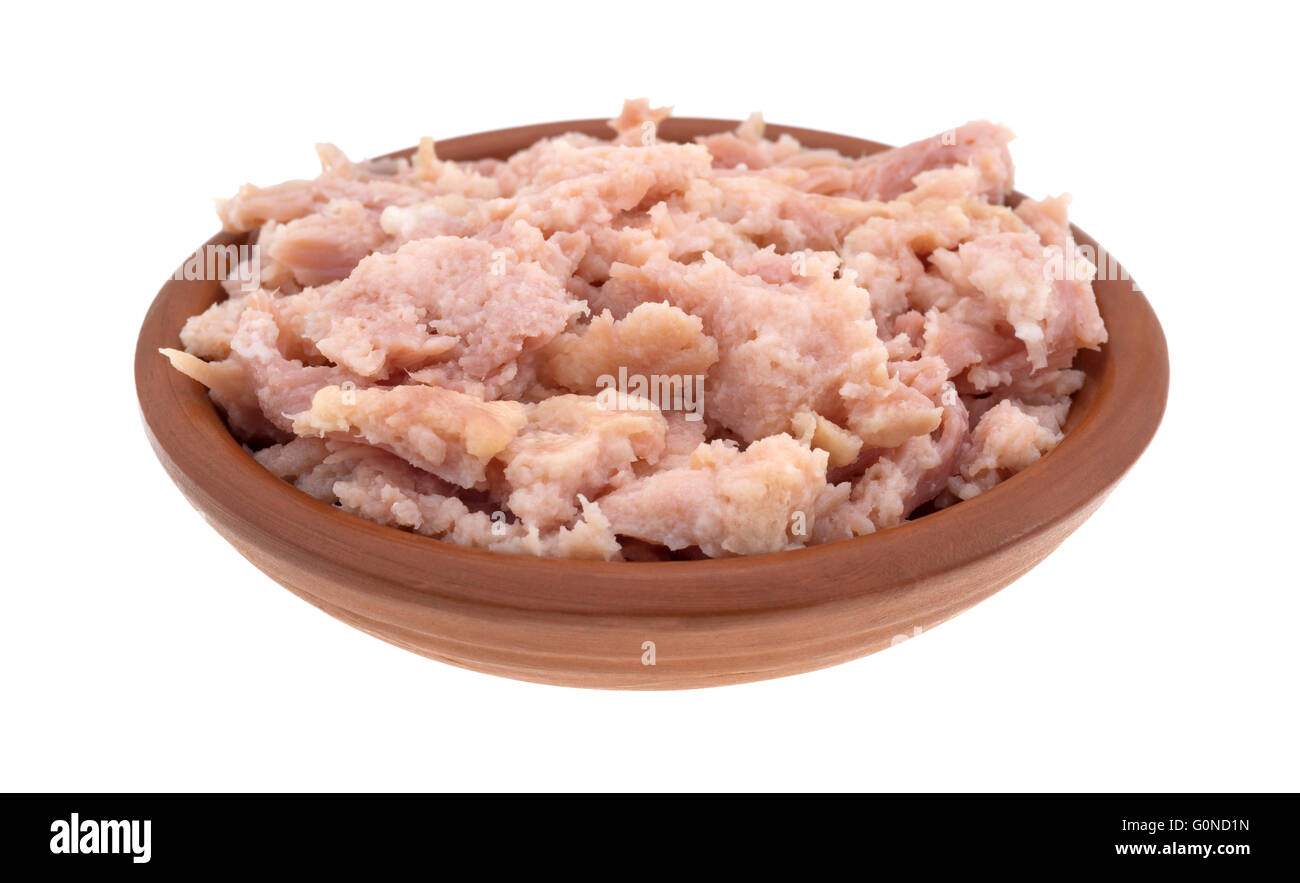 Side view of a small bowl of smoked ground ham isolated on a white ...