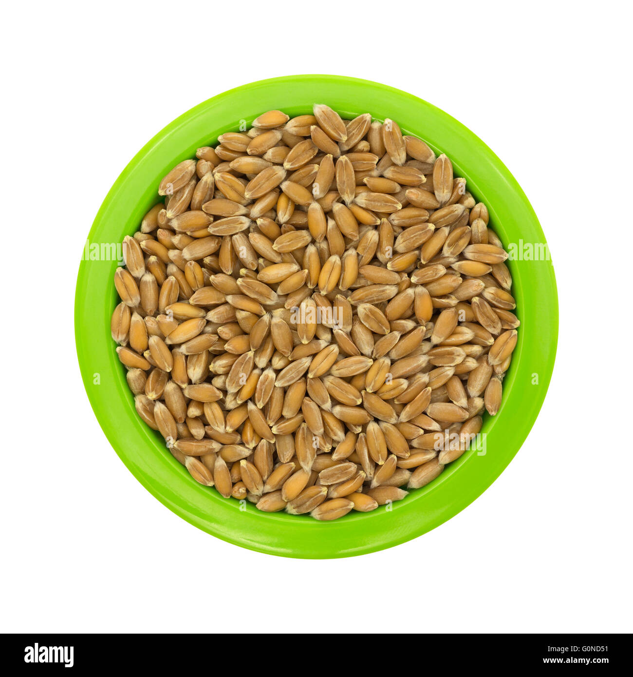 Top view of a small bowl filled with organic whole grain spelt isolated ...