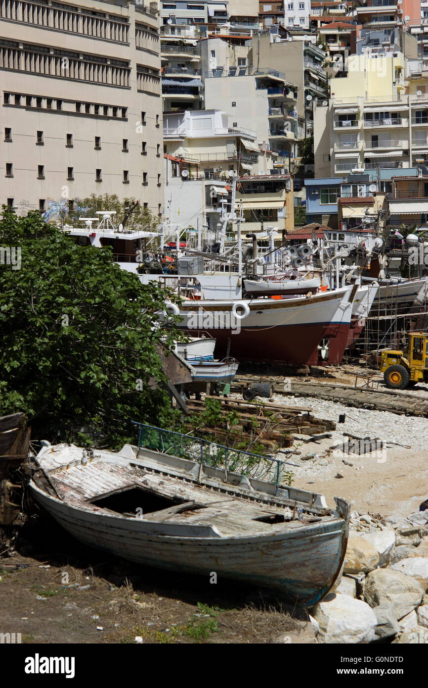 Greek fishing boats under repair hi-res stock photography and images ...