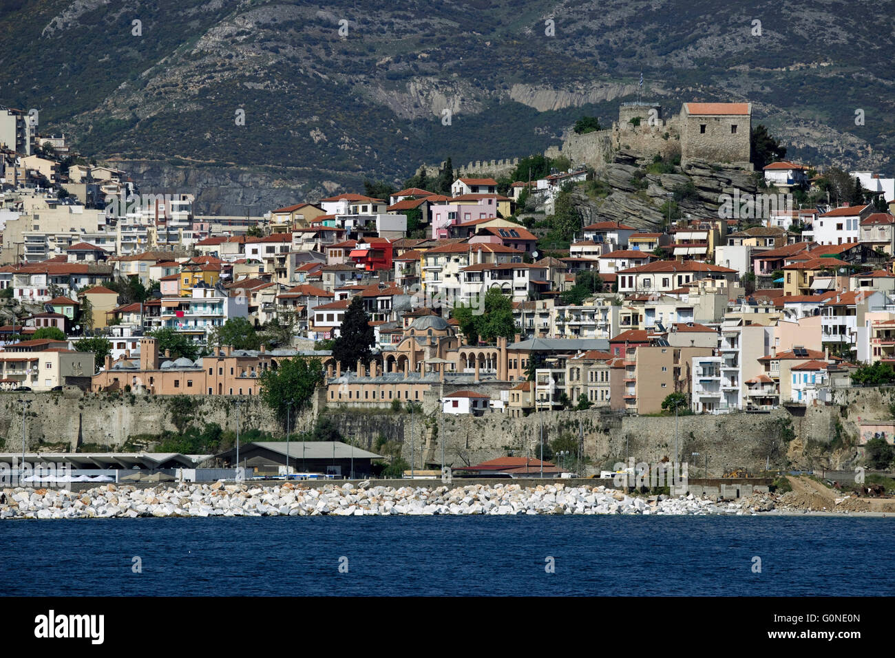 Kavala port and urban cityscape visible from a ferry deck. The ...