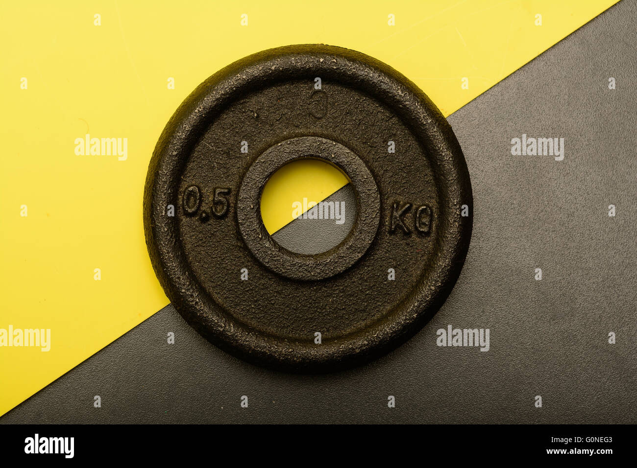 metal weight lifting disc on abstract background Stock Photo - Alamy