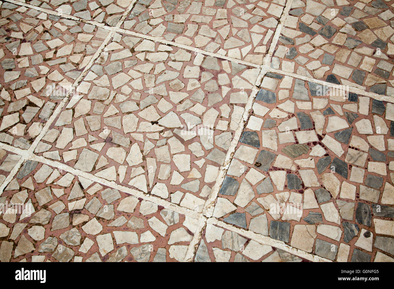 Cobblestone paving made with multi colored stones Stock Photo - Alamy