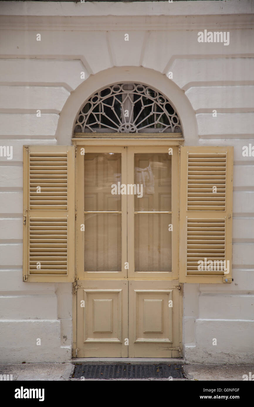 An old weathered french window with opened shutters Stock Photo - Alamy