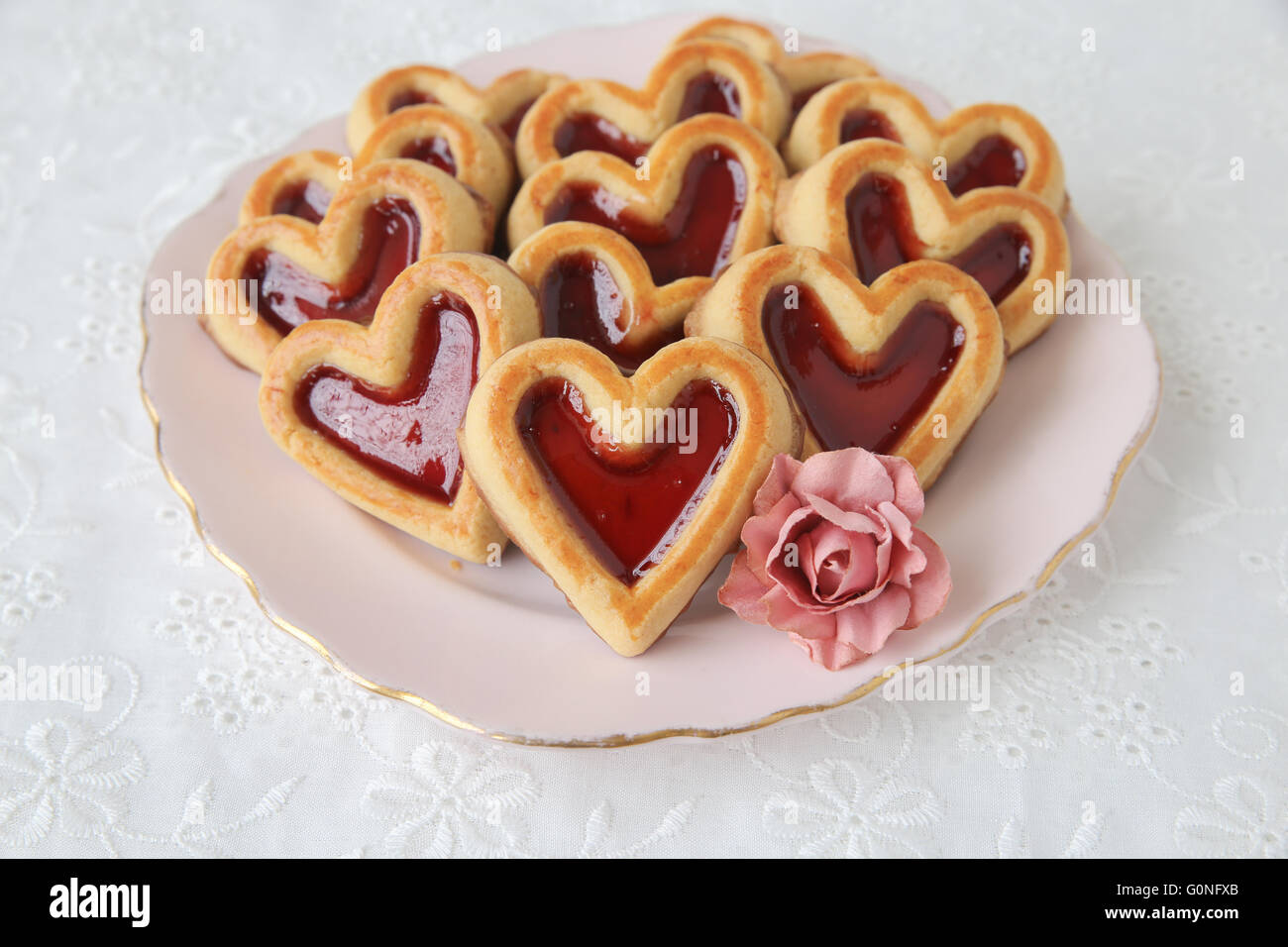 Red jam heart shaped biscuit hi-res stock photography and images - Alamy