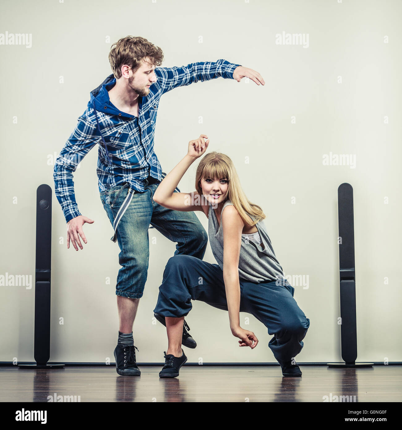 Two modern dancers couple woman and man dancing. Urban lifestyle. Hip ...