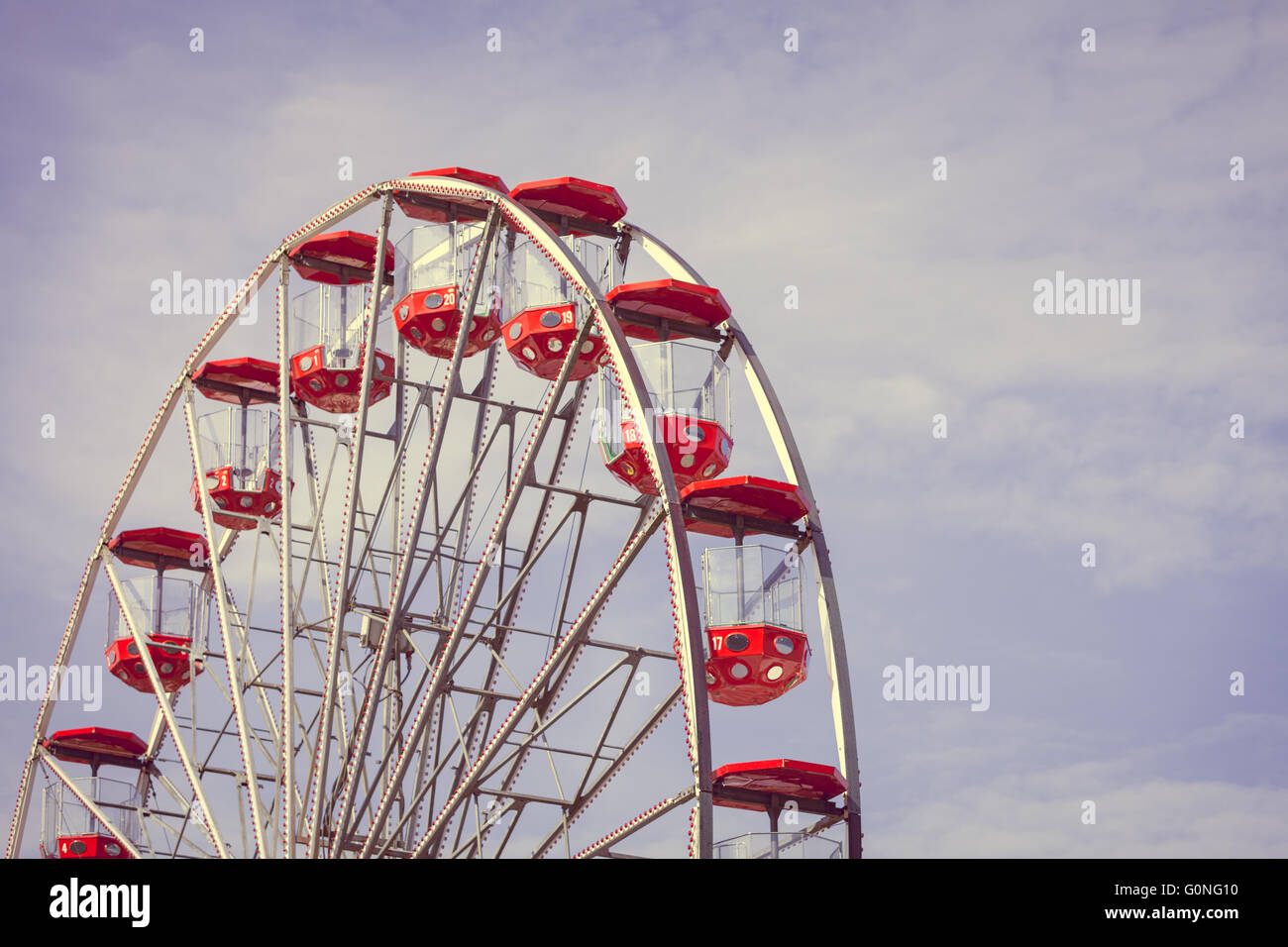 Ferris wheel on blue sky, carousel in amusement park Stock Photo - Alamy