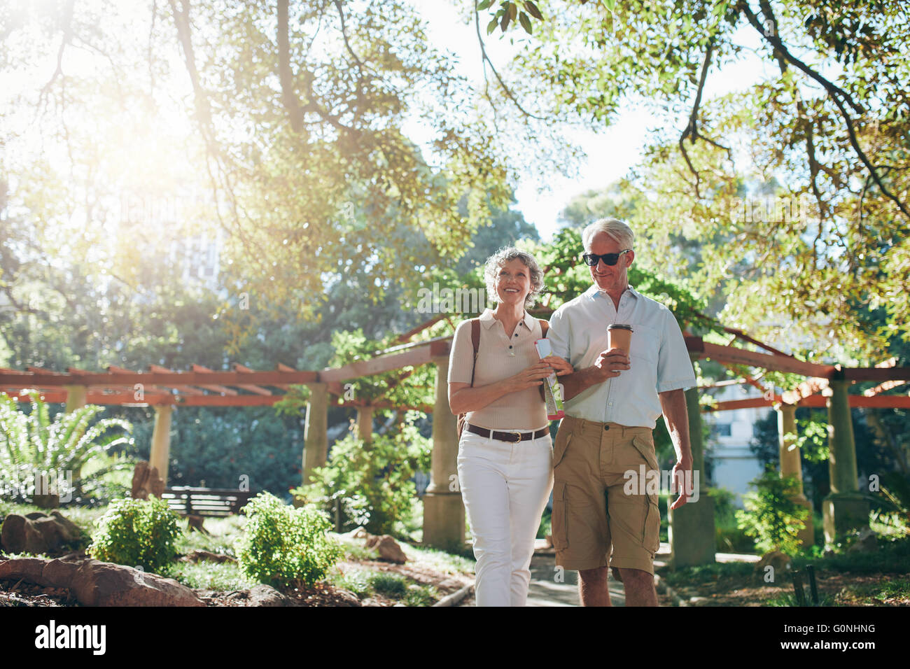 Two people walking through pathway hi-res stock photography and images ...