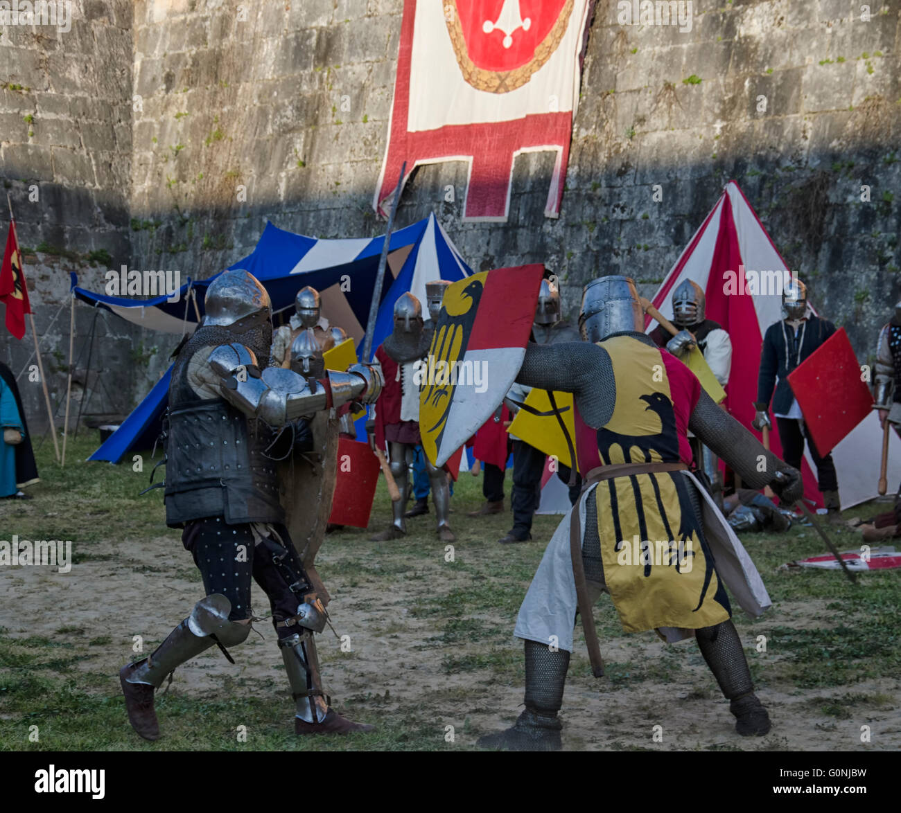 Sword fight between knights in historical re-enactment at Pisa Stock ...
