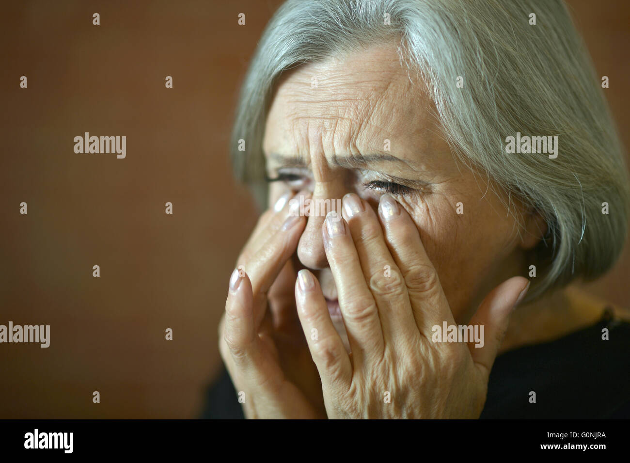 crying elderly woman Stock Photo - Alamy