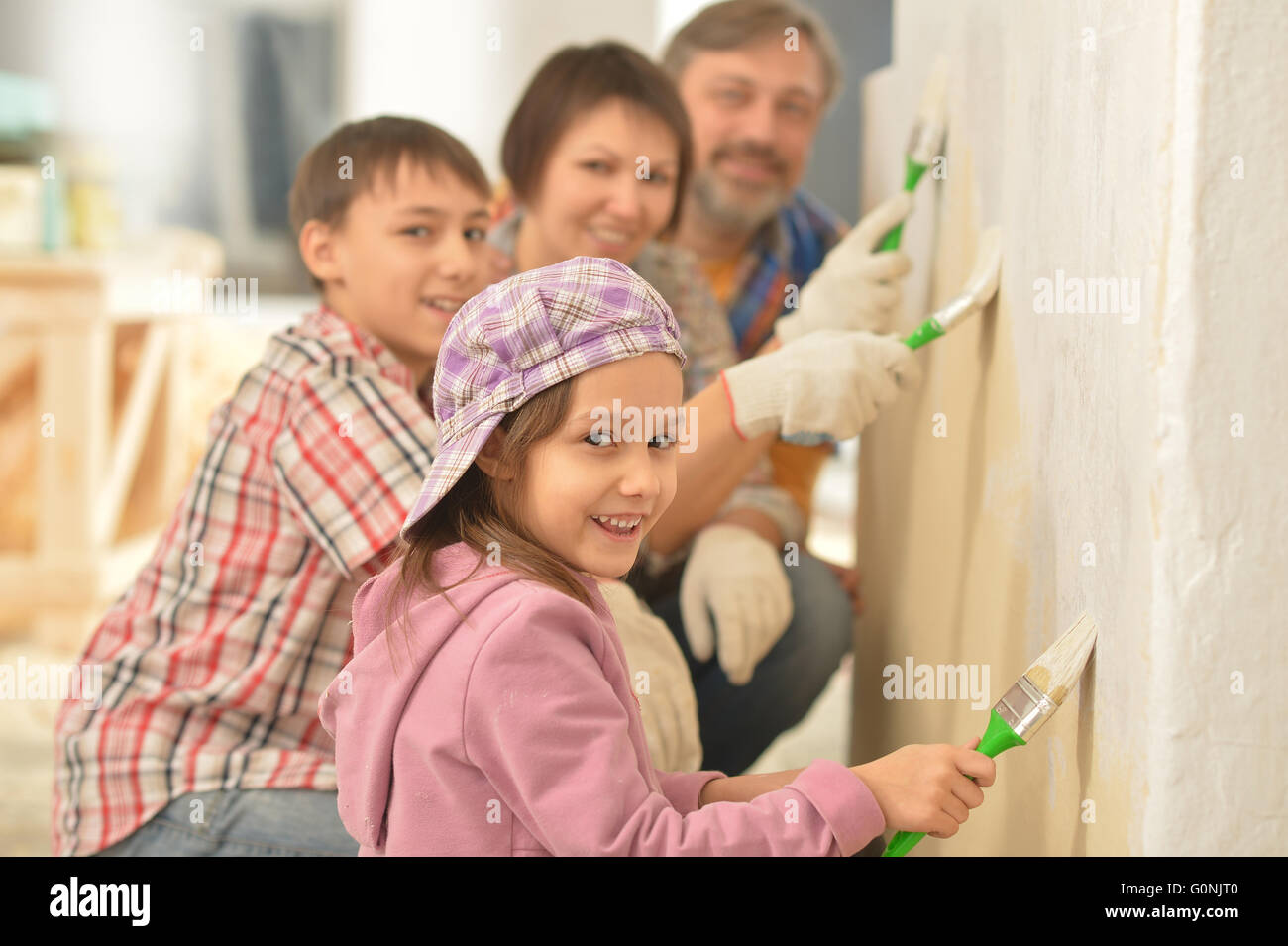 happy family doing repair at home Stock Photo - Alamy