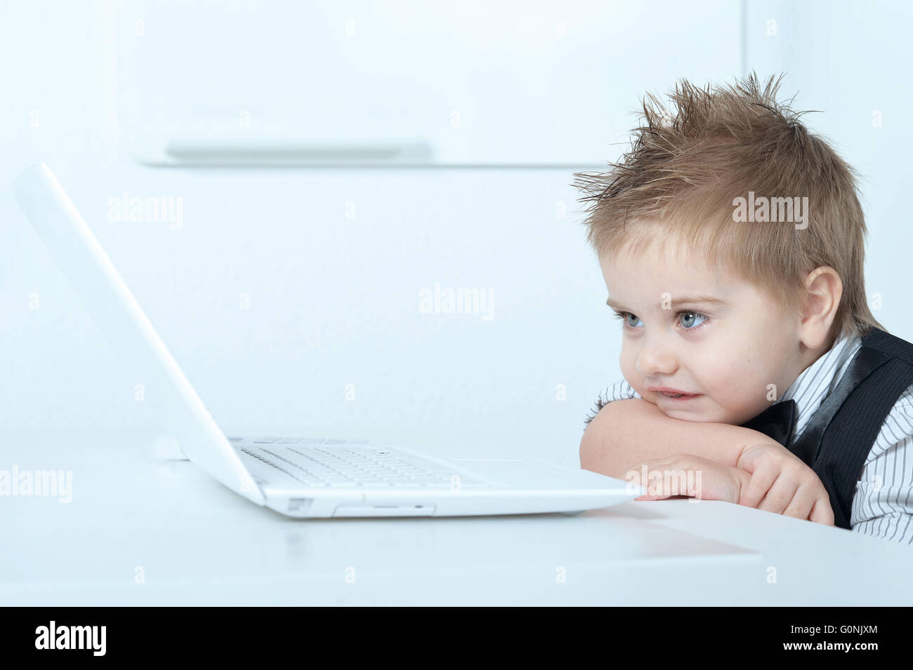 Little boy using laptop Stock Photo - Alamy