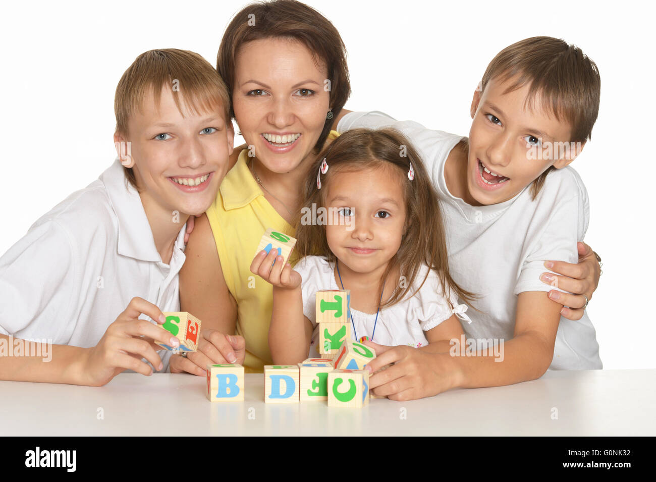Family playing with cubes Stock Photo - Alamy