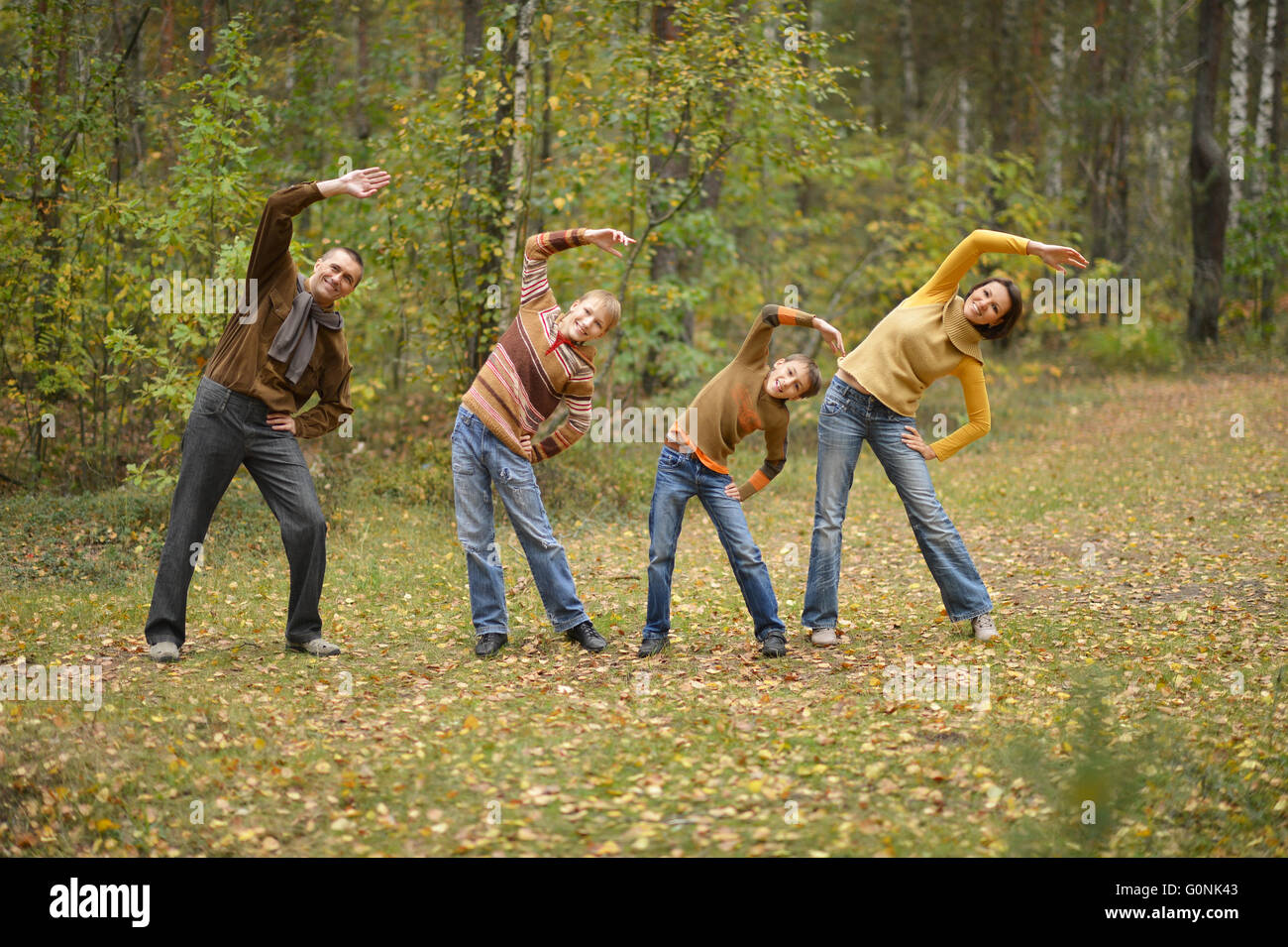 Family doing exercises Stock Photo - Alamy