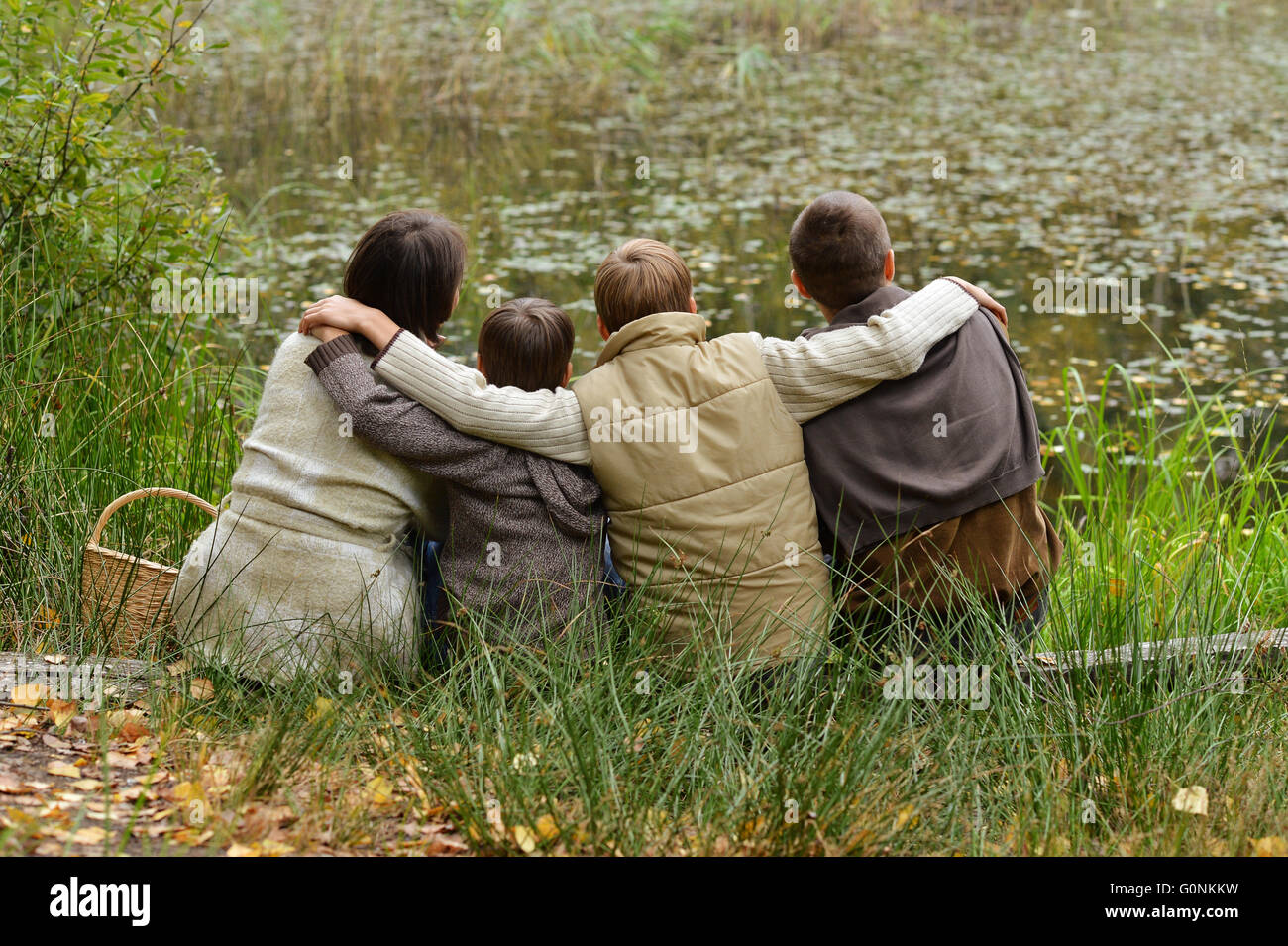 Family of four picking Stock Photo - Alamy