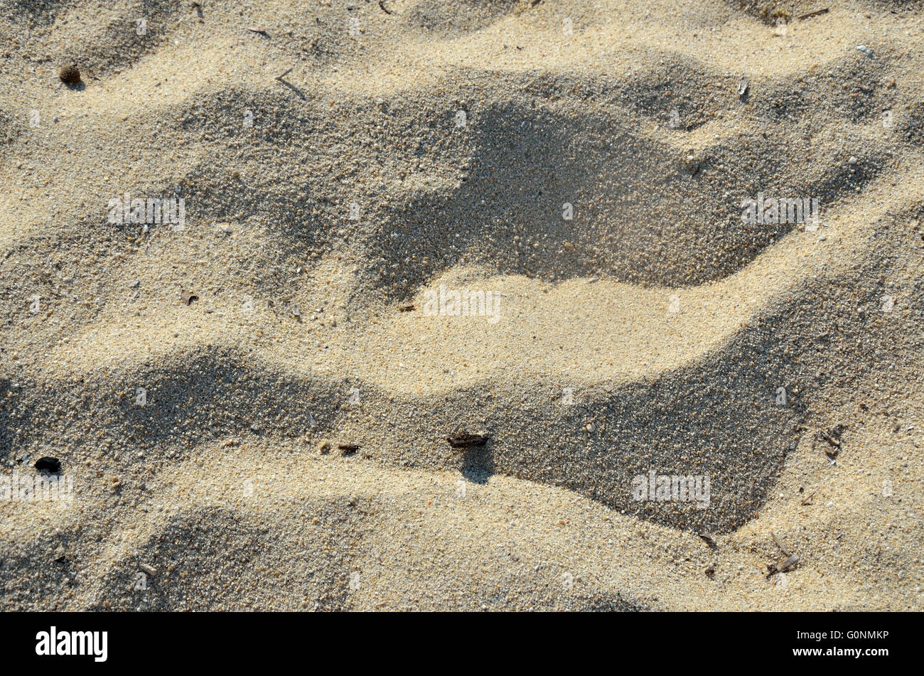 Sandy surface on the beach with small dunes on it Stock Photo - Alamy