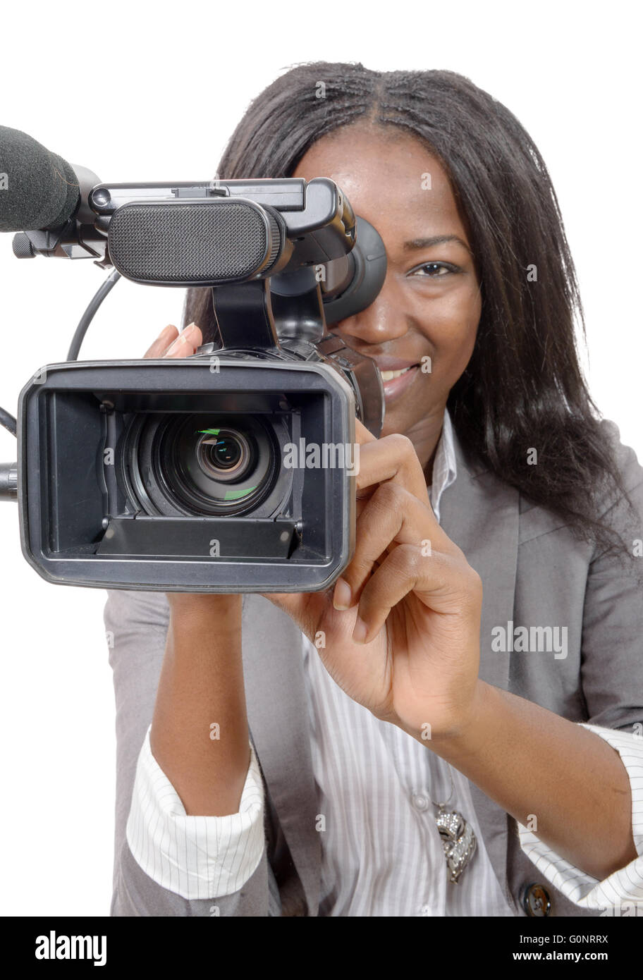 a young African American women with professional video camera on white ...