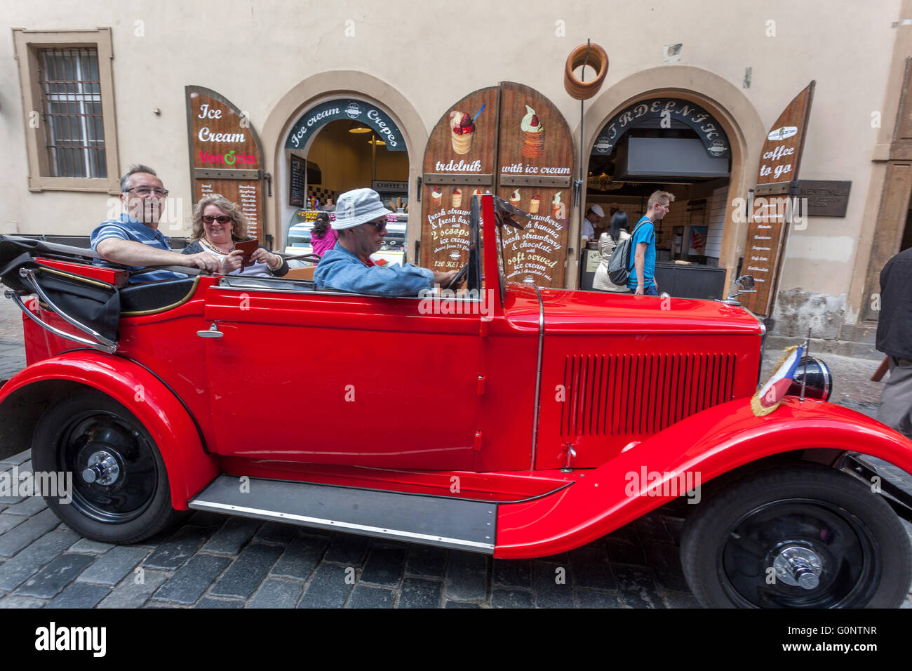 Tourists passing Charles Street, Old Town, trdelnik pastry shop, Prague ...