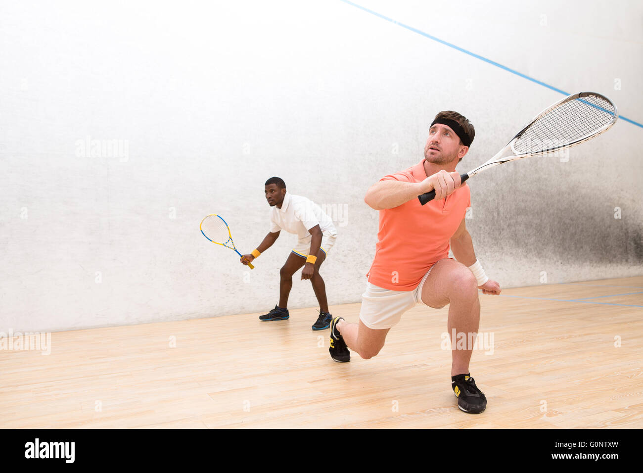 Men playing squash Stock Photo - Alamy