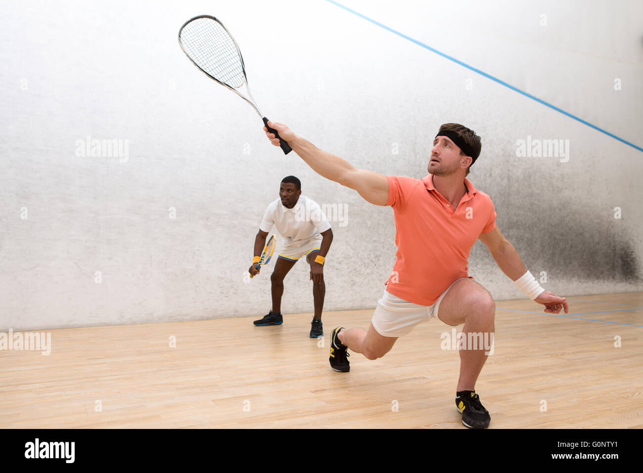 Men playing squash Stock Photo - Alamy