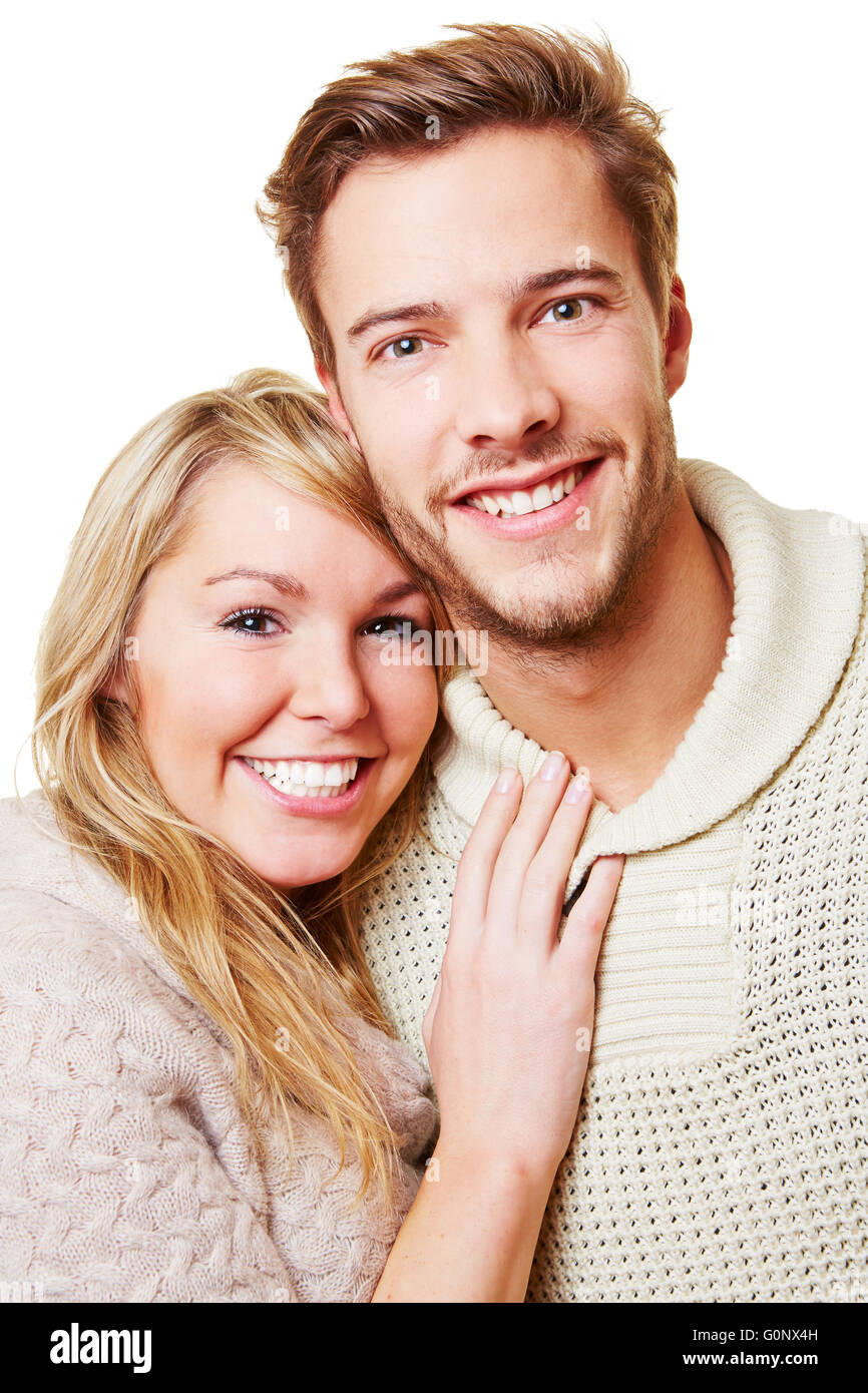 Happy young couple looking directly into the camera Stock Photo - Alamy