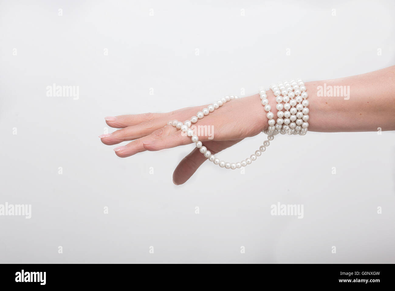 Beads on hand Stock Photo - Alamy