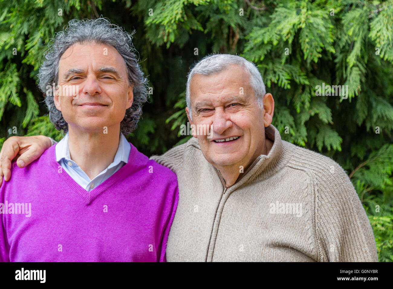 father and son, Elderly man and middle-aged man together in the garden ...