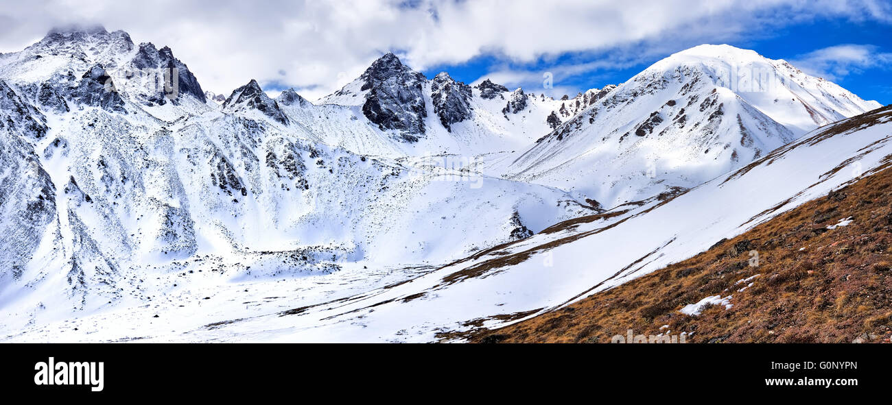 Mountain peaks of Eastern Sayan at end of April. Peak of Constitution ...