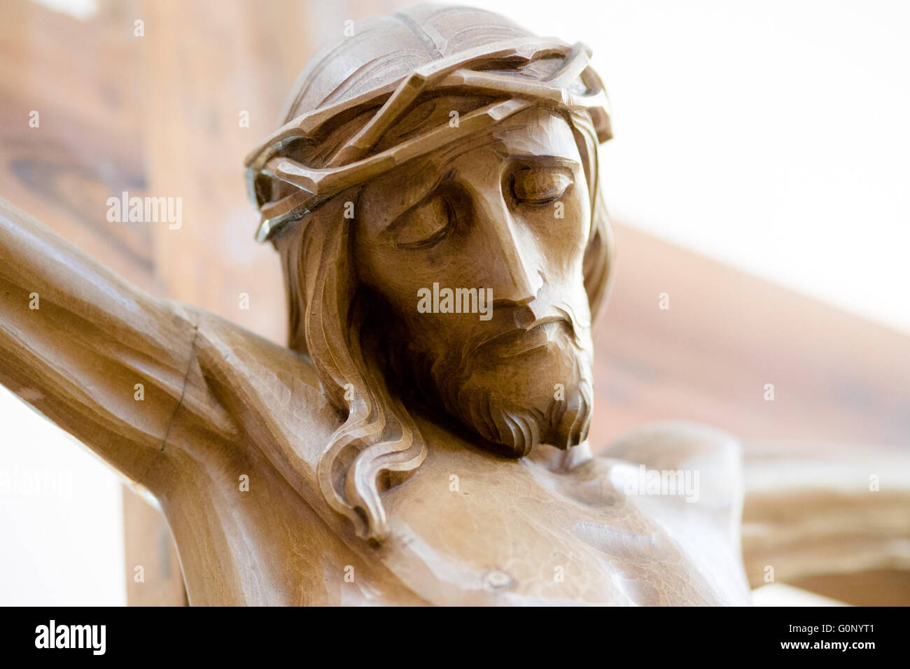 the face of Jesus crucified on the cross in a wooden statue Stock Photo ...
