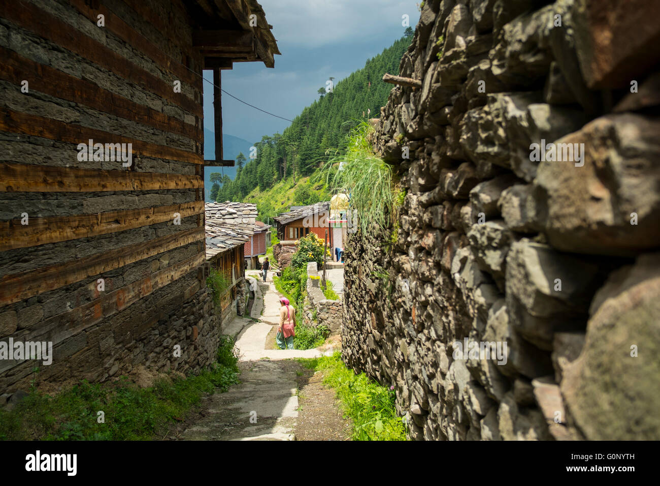 An alley between beautiful Himalayan Log Houses in the traditional ...