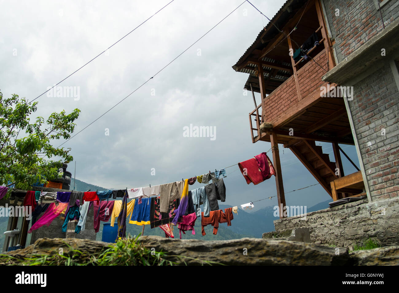 Laundry drying outside a brick house in the Himalayan village of ...