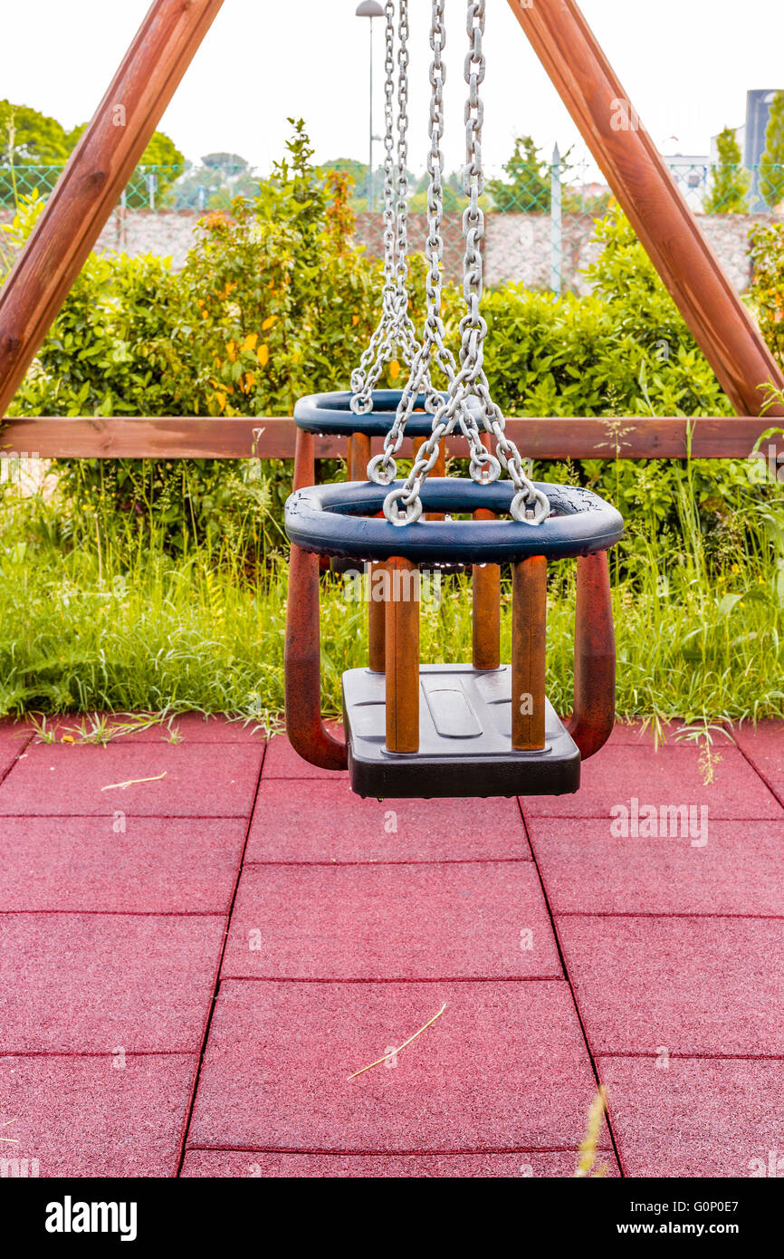 Swings in public park hi-res stock photography and images - Alamy