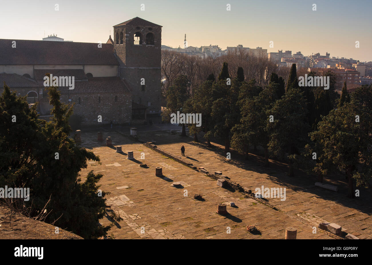 View of the St. Giusto cathedral and roman ruins Stock Photo - Alamy