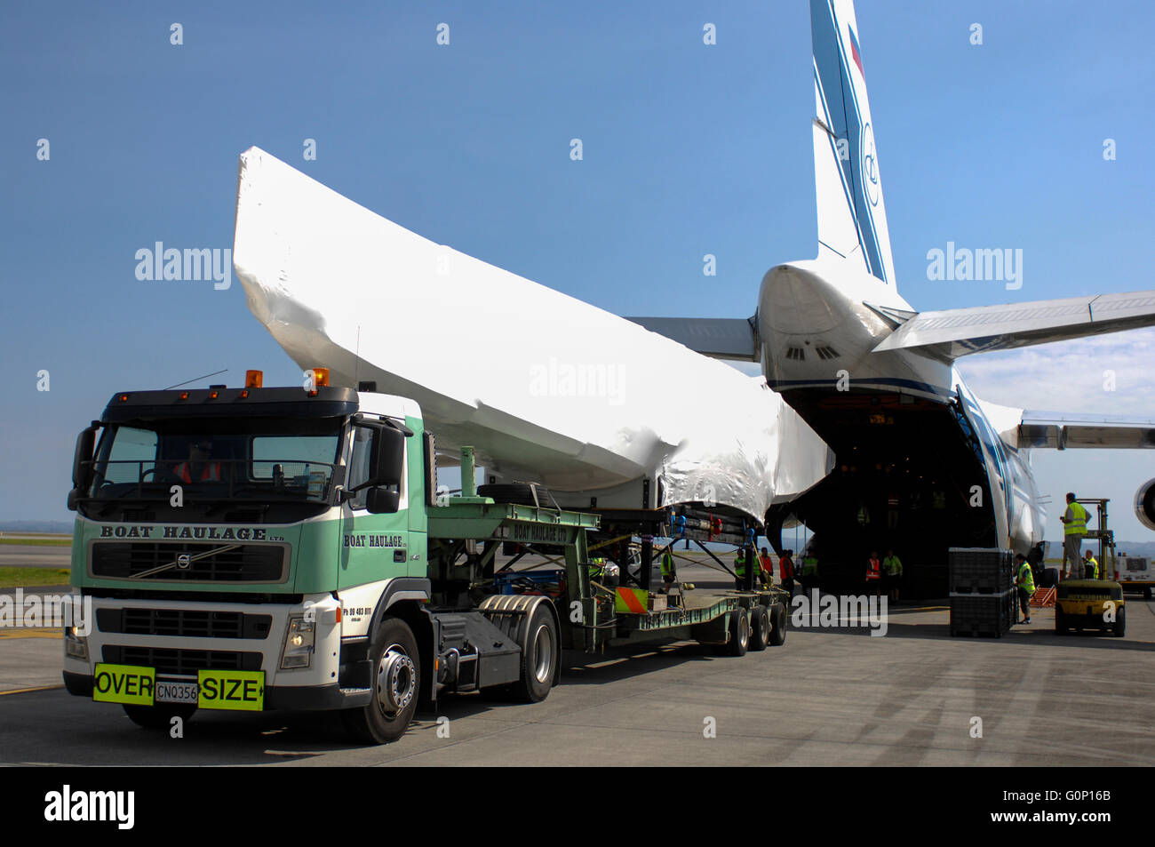 Yacht hull being loaded into the cargo bay through the rear doors of ...
