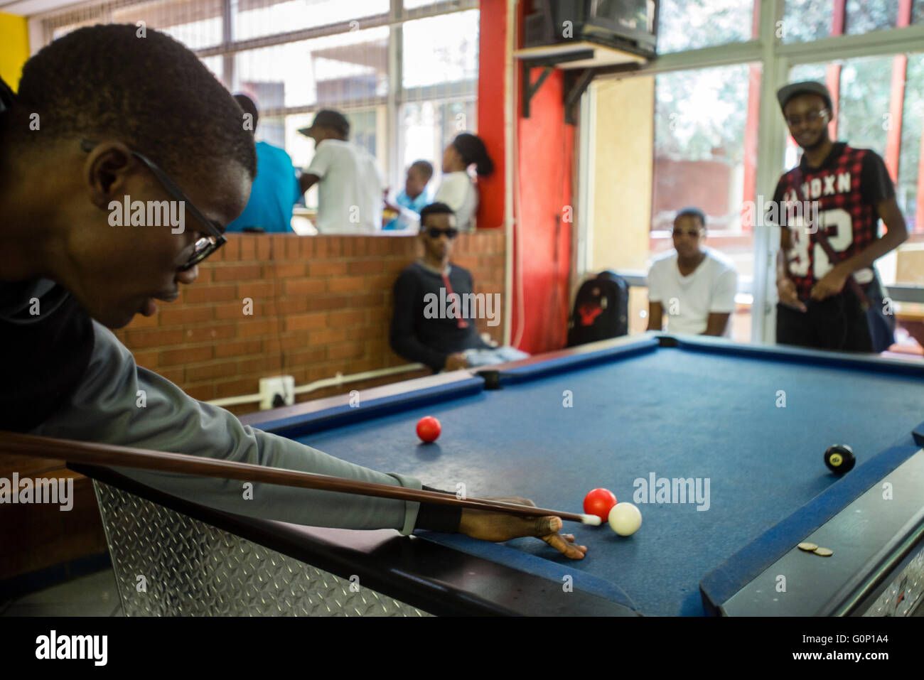 Students play billiards in the entertainment and Internet cafe at the ...