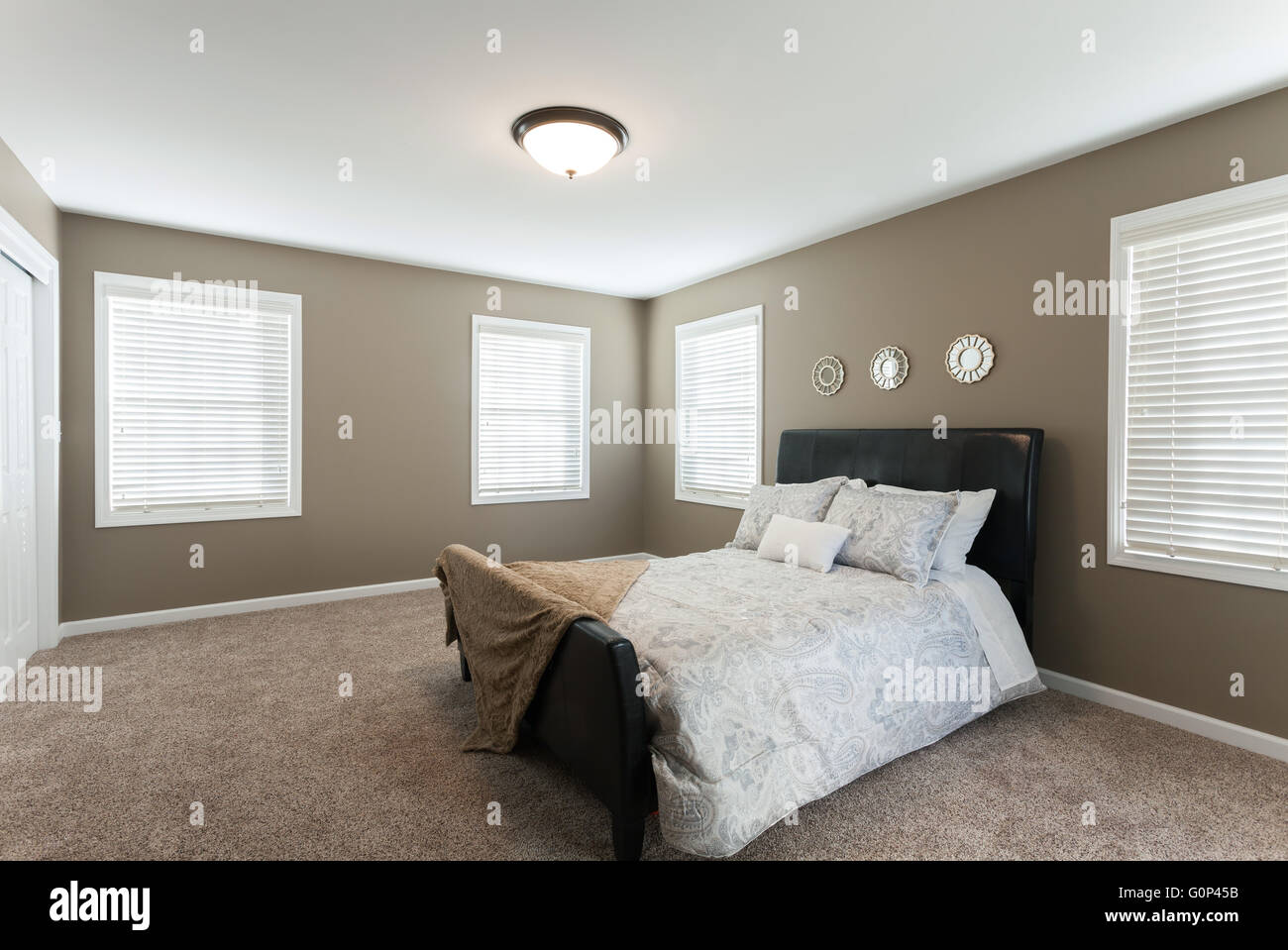 Beautiful staged master bedroom in a modern house Stock Photo - Alamy