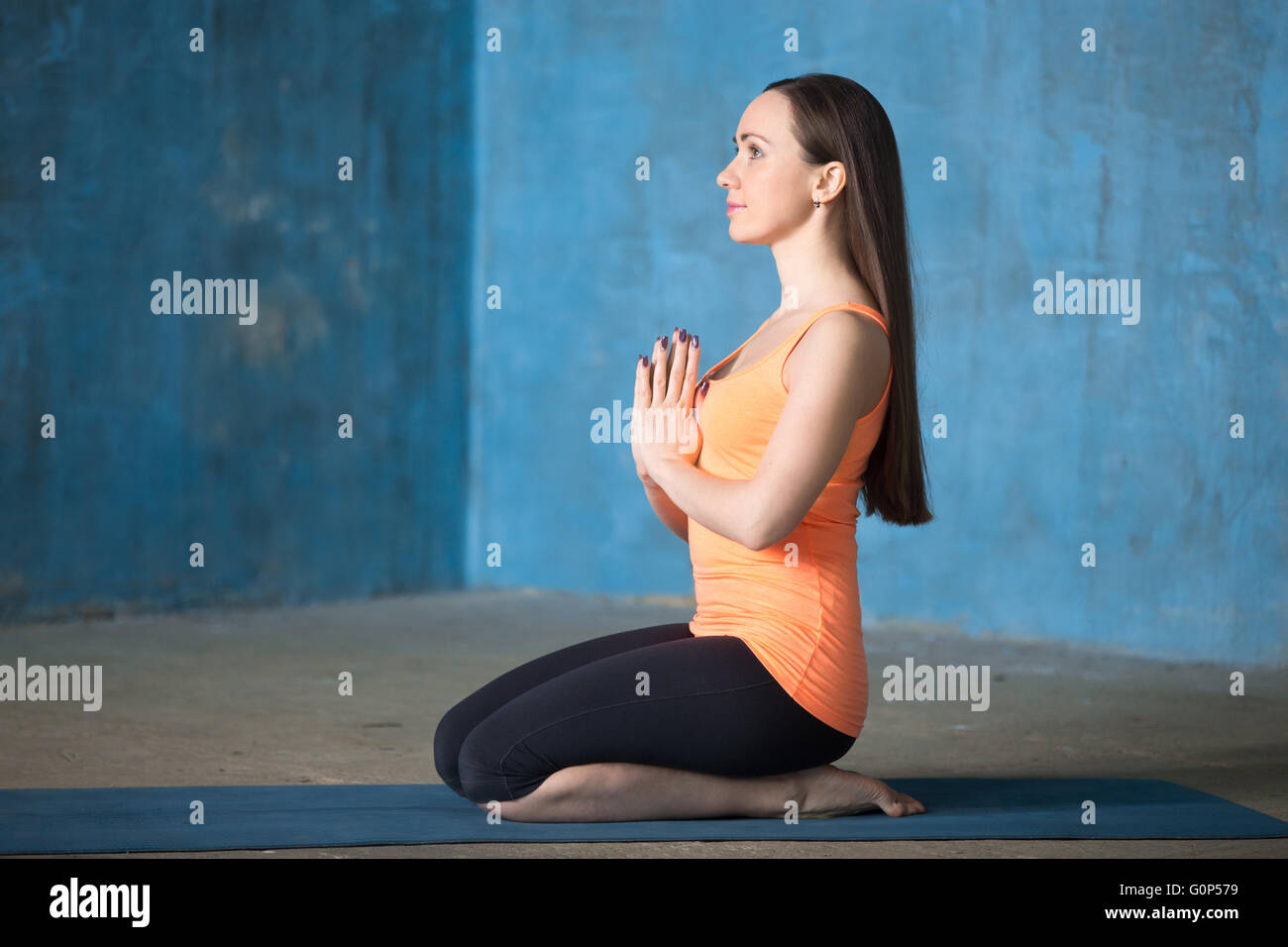 Profile portrait of beautiful young woman dressed in bright sportswear ...