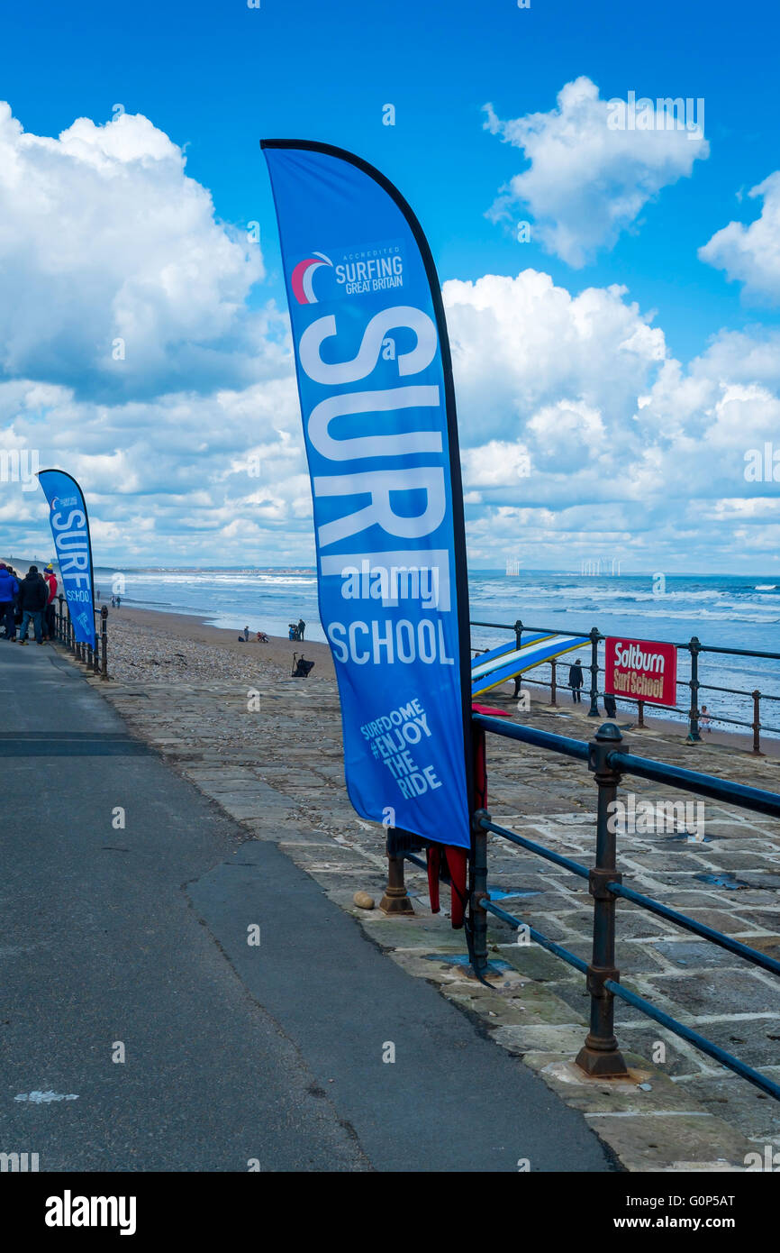 Sign for Saltburn Surf School on the promenade railings Stock Photo - Alamy