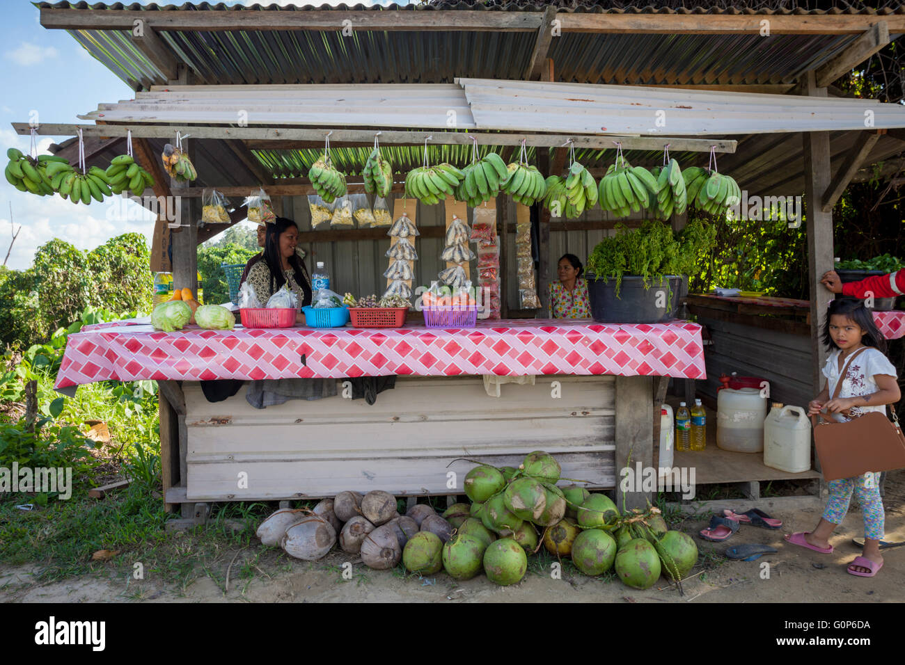 Traditional roadside stall selling fruit and produce - bananas, melons ...