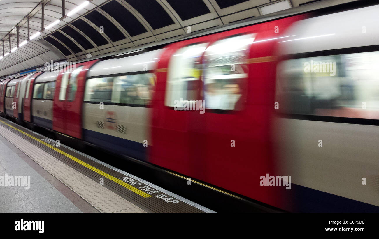Train arrives at Angel Underground Station platform, Islington, London ...